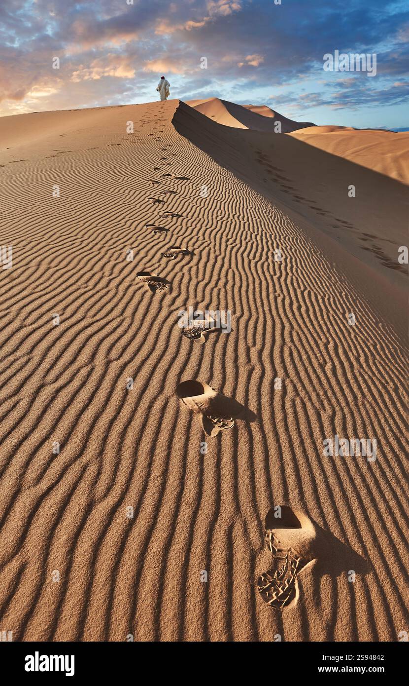 Man walking in the beautiful Erg Chebbi Saharah Sand Dunes, Sahara ...