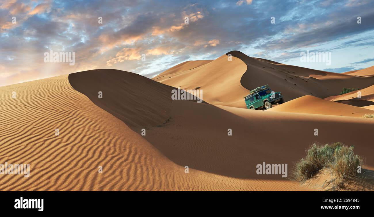 Land Riover Defender driving in the beautiful Erg Chebbi Saharah Sand ...