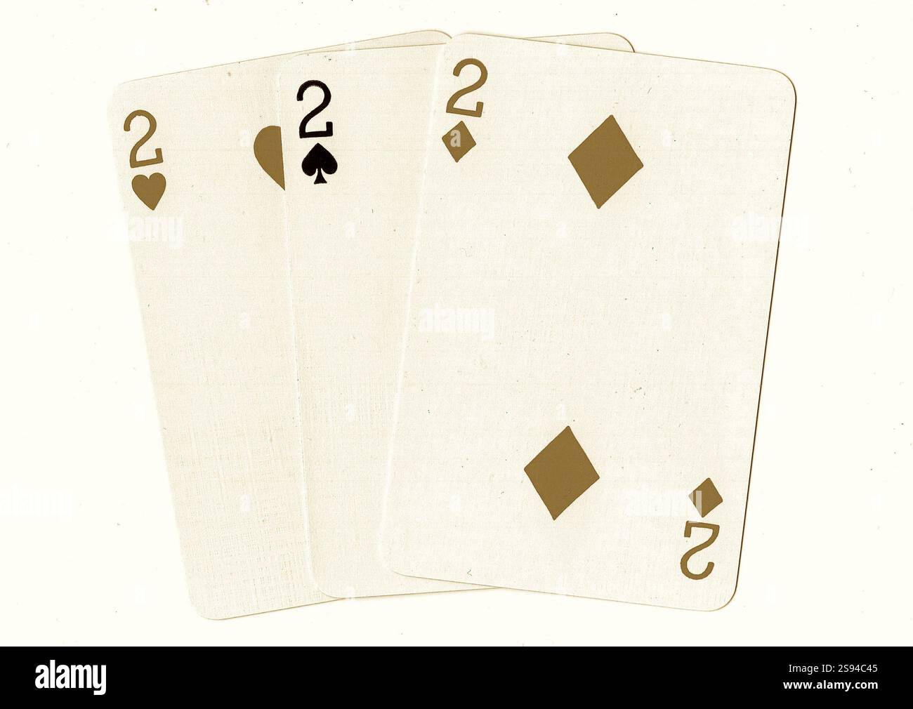 Vintage playing cards showing three of the same value in sepia isolated ...