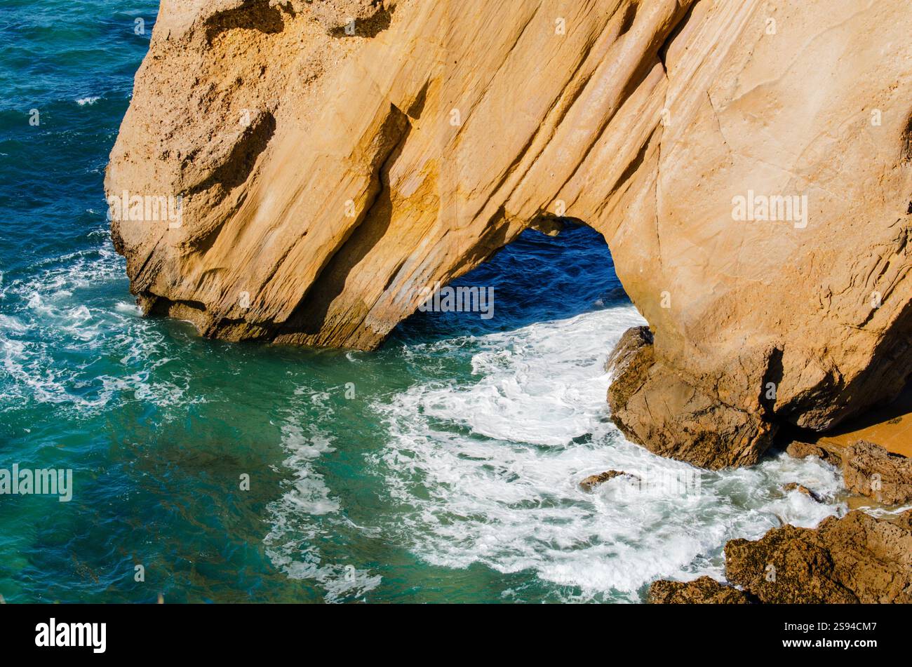 Cliffs in the sea. Praia de Santa Cruz. Colours of Portugal Stock Photo ...