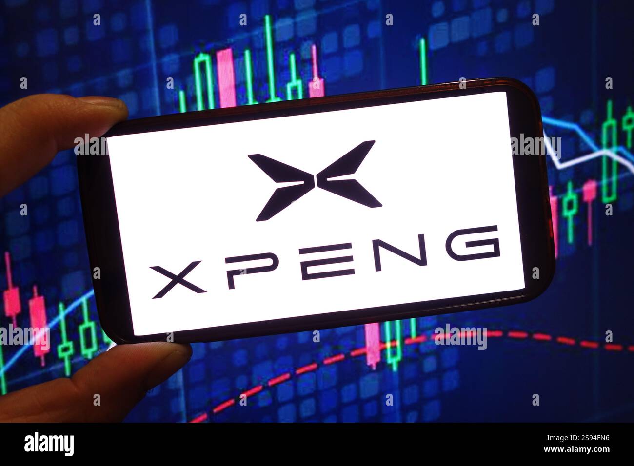 In this photo illustration, the XPeng company logo is seen displayed on ...