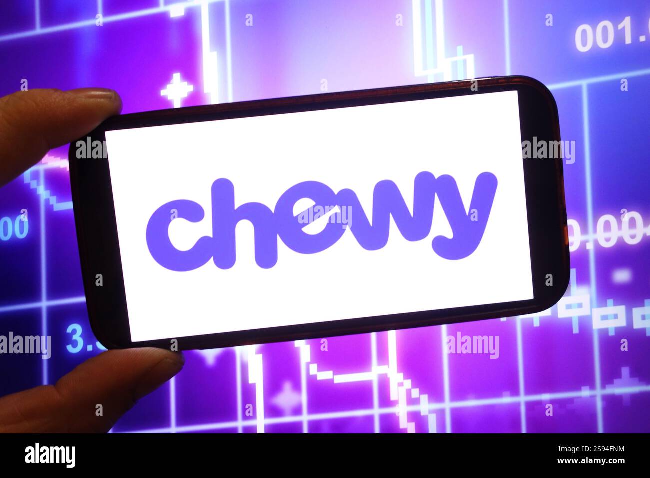 In this photo illustration, the Chewy Inc company logo is seen ...