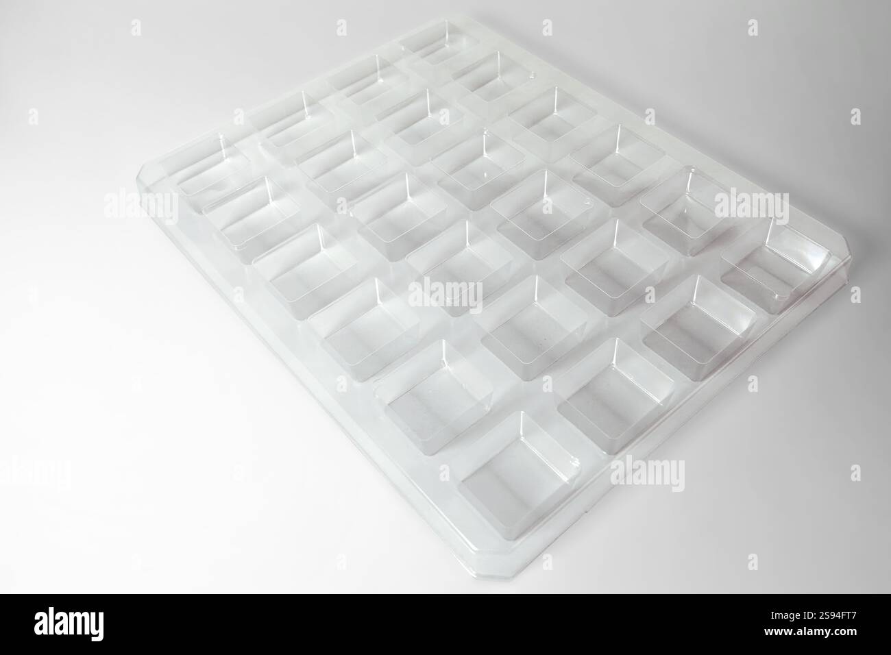 An industrial transparent square thermoforming mold made of plastic as a packaging solution for ...