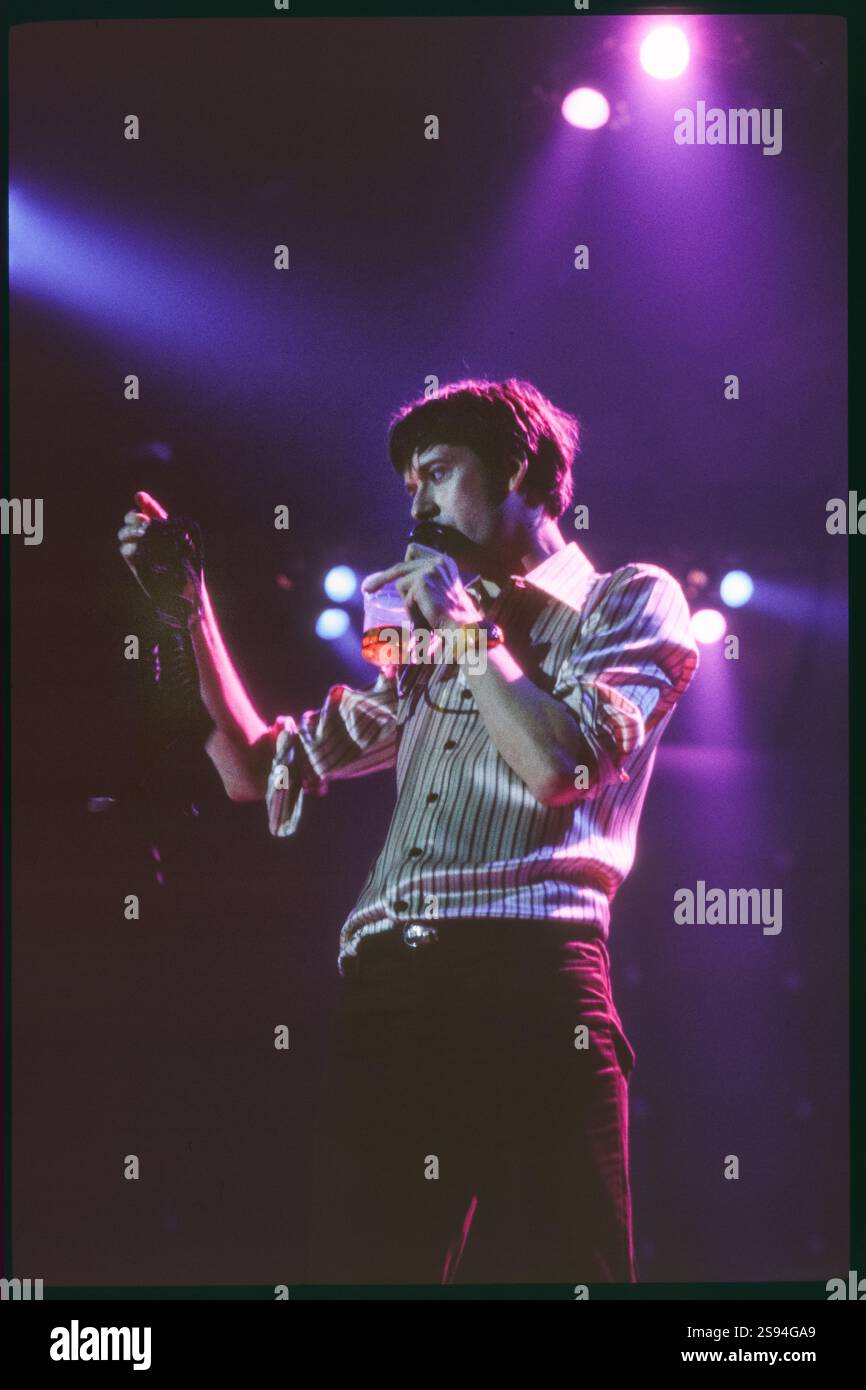 JARVIS COCKER, DIFFERENT CLASS TOUR, 1996: Jarvis Cocker of the band Pulp holds up a bra thrown ...