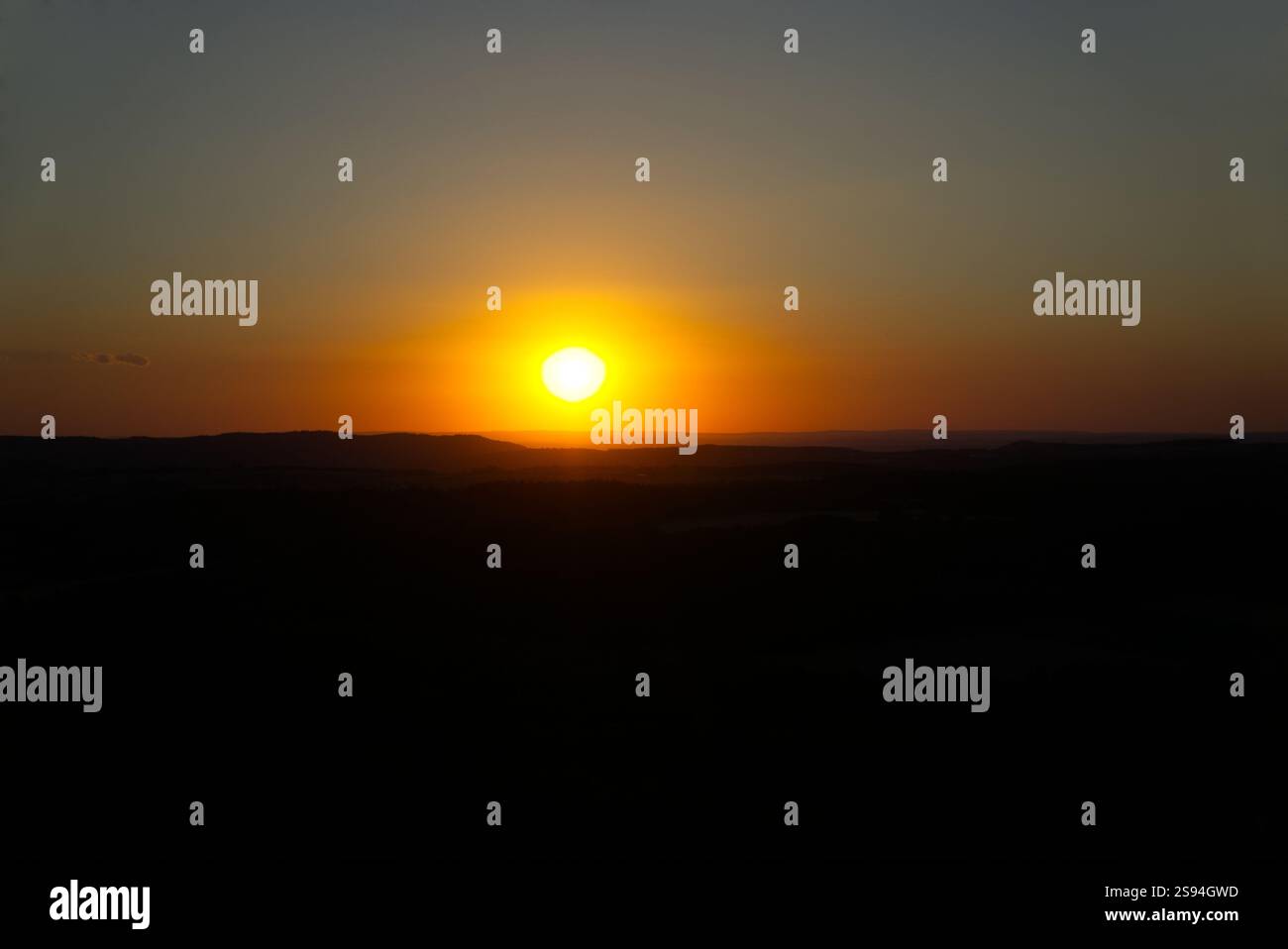 View from the Hursch observation tower: Low sun with sunset against an ...