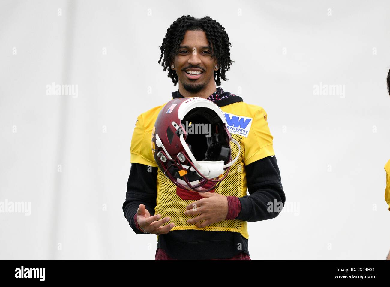 Washington Commanders quarterback Jayden Daniels (5) flips his helmet ...