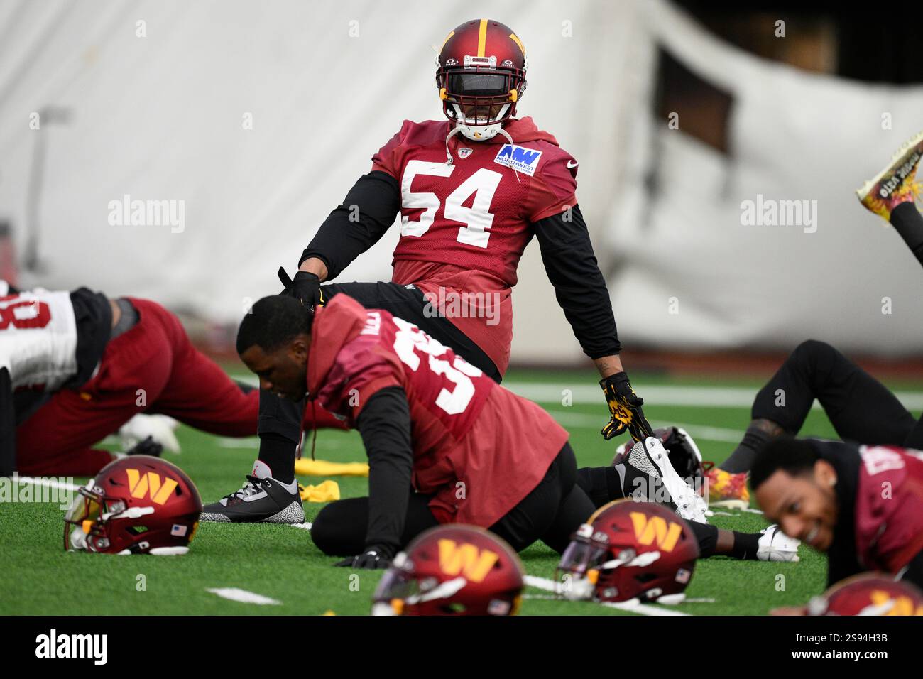 Washington Commanders linebacker Bobby Wagner (54) stretches during NFL ...
