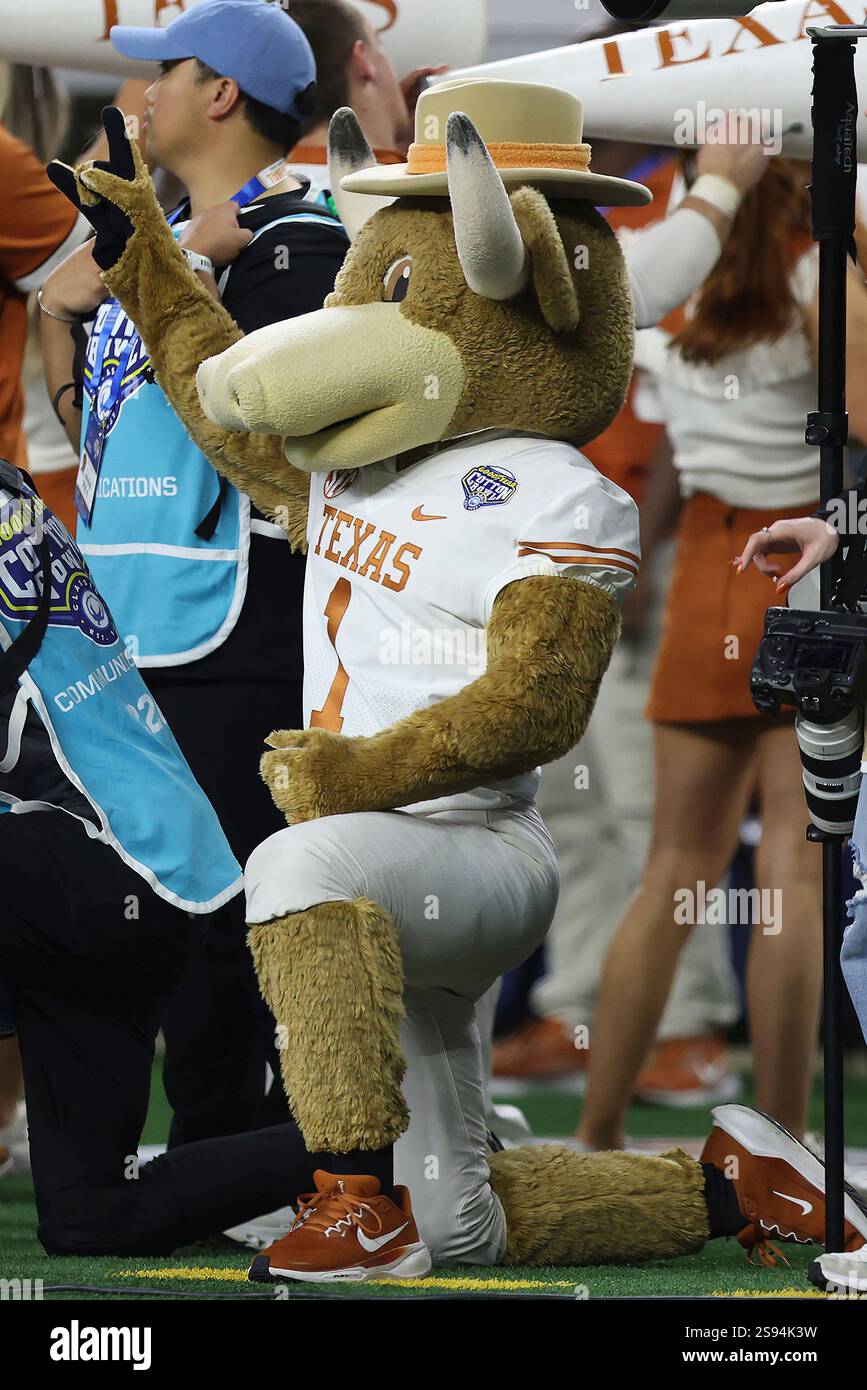 Texas mascot kneels to watch a play during the Cotton Bowl NCAA College ...