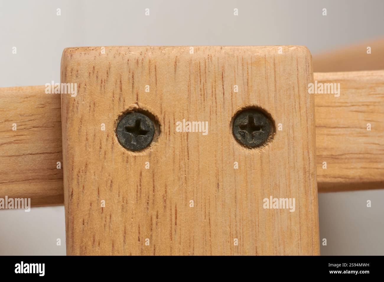 close-up macro view of countersunk black phillips head metal screws ...
