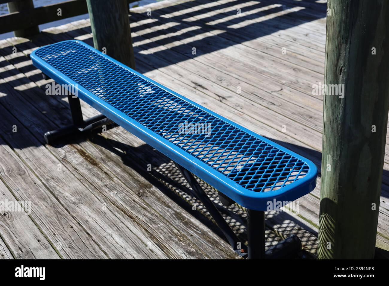 Blue metal mesh outdoor bench seat Stock Photo - Alamy