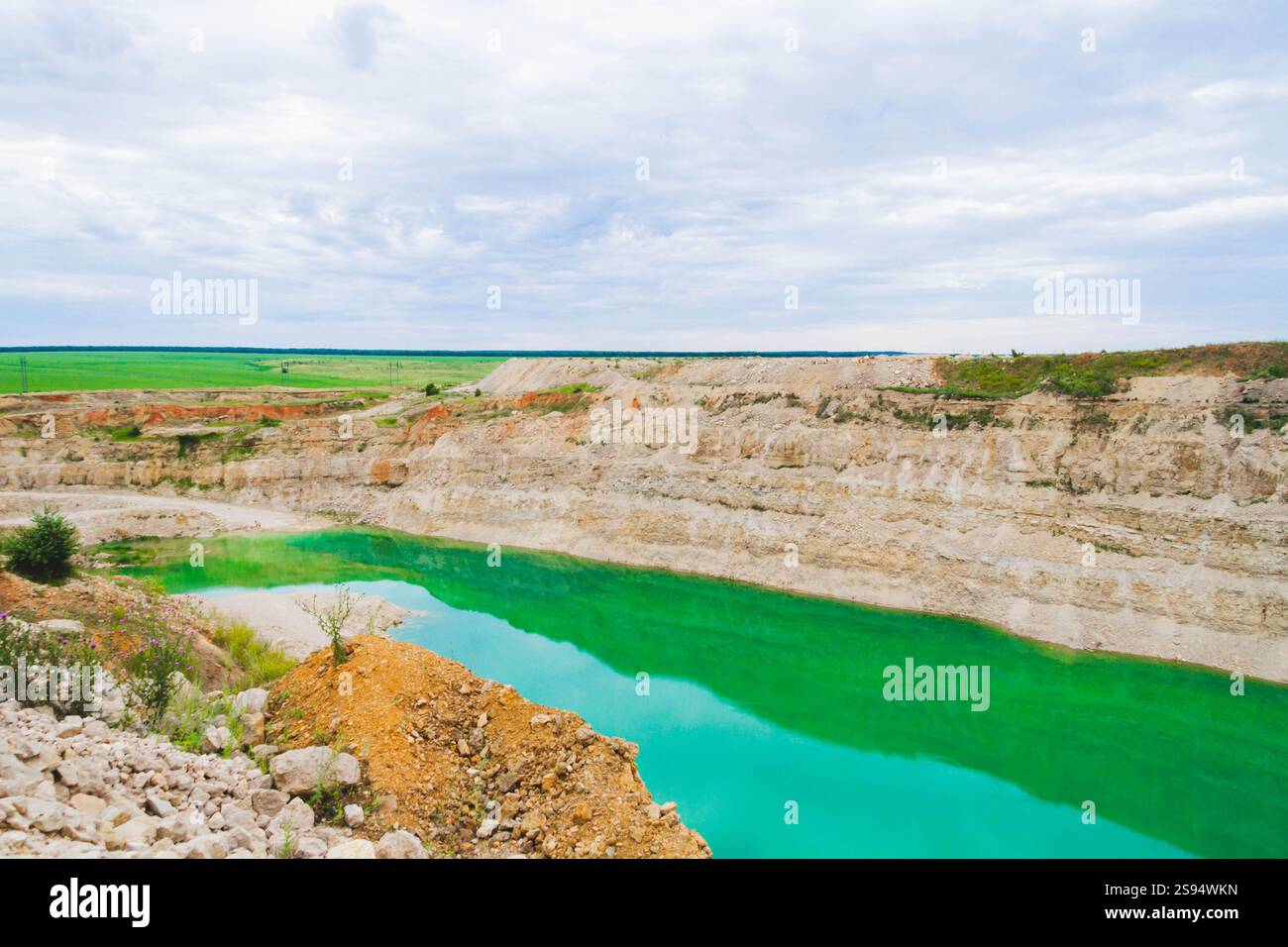 Lake formation in an old abandoned quarry. Quarry lake. Crushed stone ...
