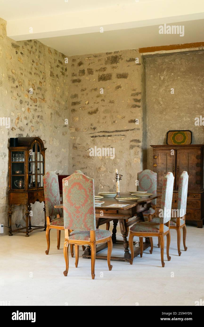 Interior dining room of the 11th century hilltop chateau once owned by Marquis de Sade in the ...
