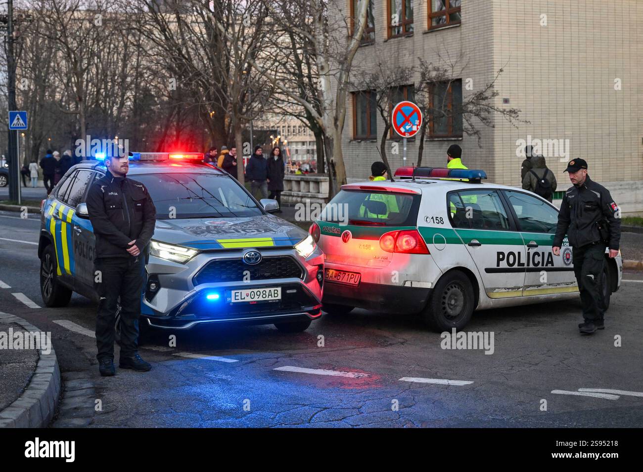 Bratislava, Slovakia. 24th Jan, 2025. Police officers watch a rally for ...