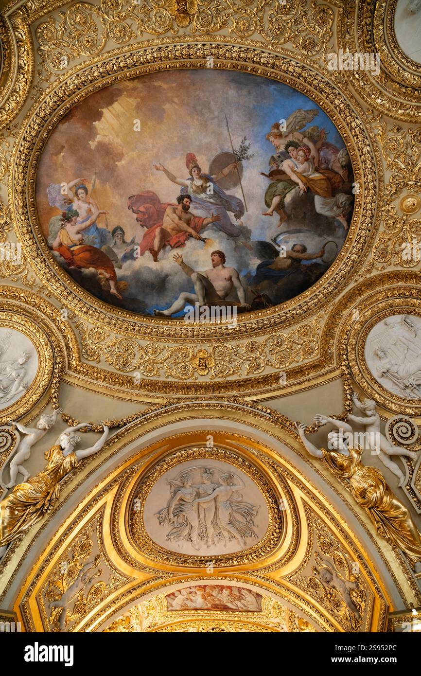 Ceiling at the Louve with a oil painting inside gold circles ...
