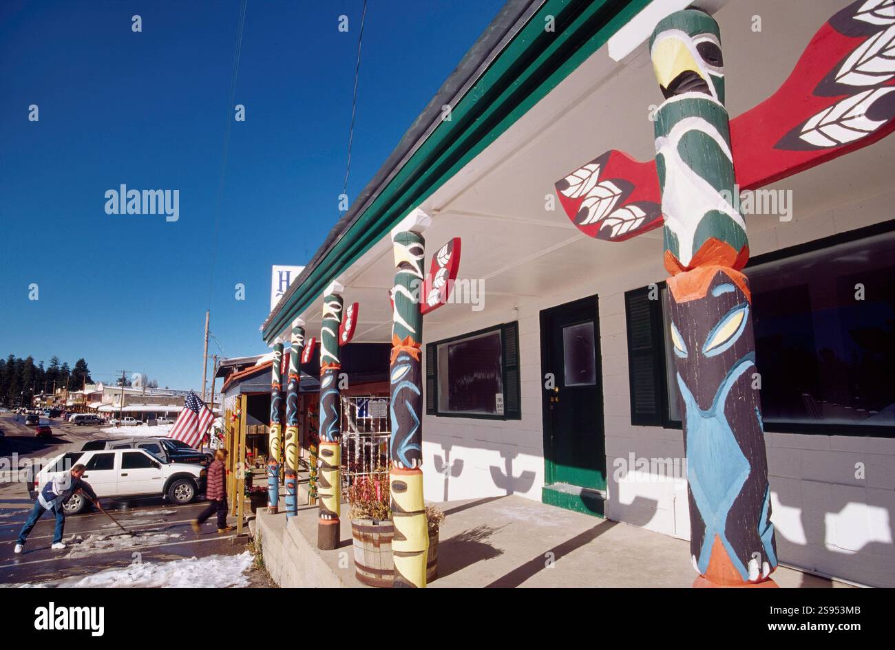 Totem pole like columns at porch shops at Burro Avenue, winter, in ...