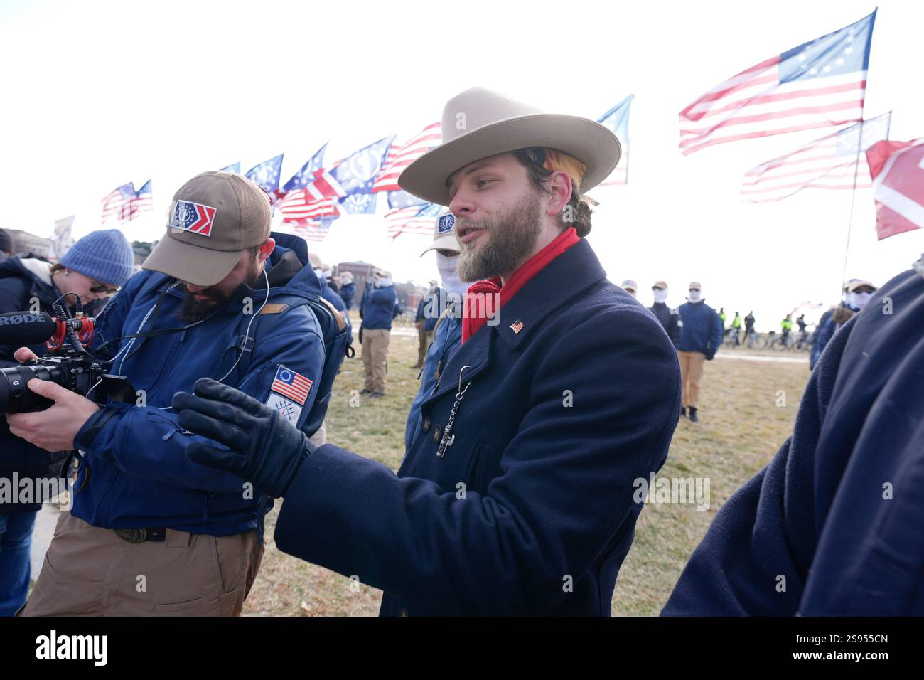 Thomas Ryan Rousseau, center, and members of a group calling themselves ... Thomas Ryan Rousseau, center, and members of a group calling themselves ...