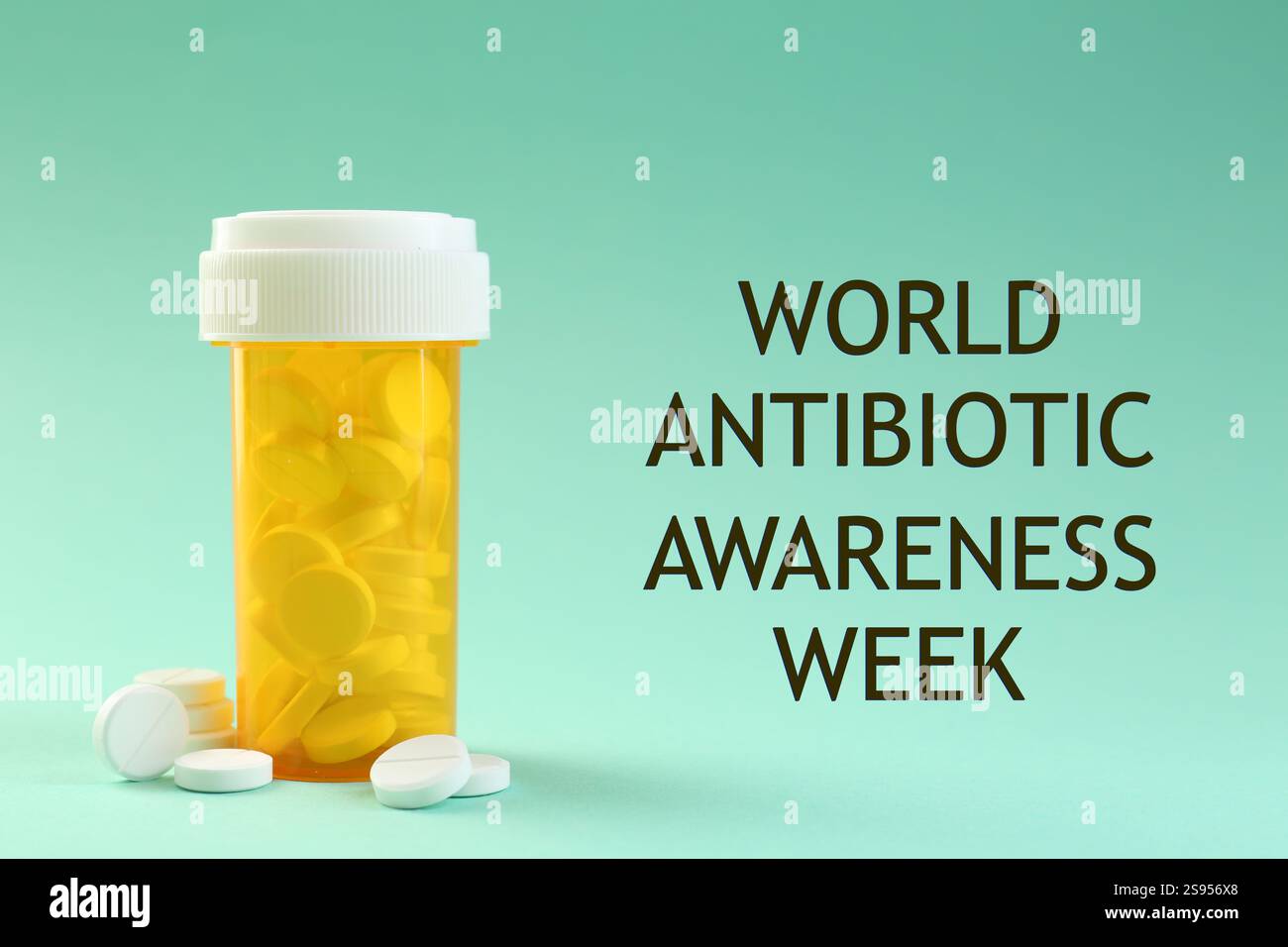 World antibiotic awareness week. Bottle and scattered pills on ...