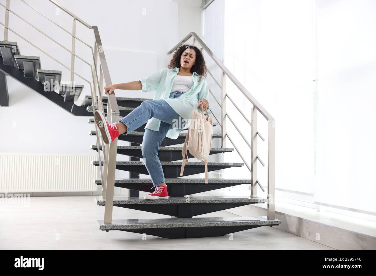 Woman falling on stairs in building. Dangerous accident Stock Photo - Alamy