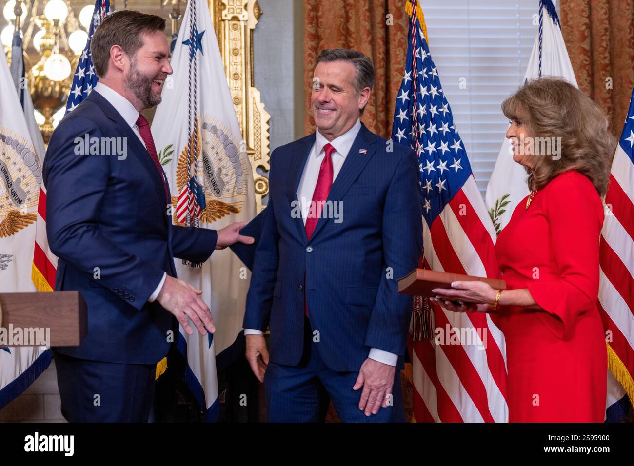 United States Vice President JD Vance shakes hands with John Ratcliffe ...