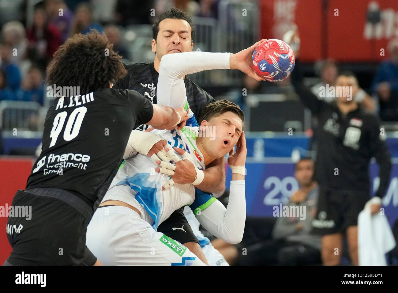 Egypt's Ali Zein, left, challenges for the ball with Slovenia's Domen ...