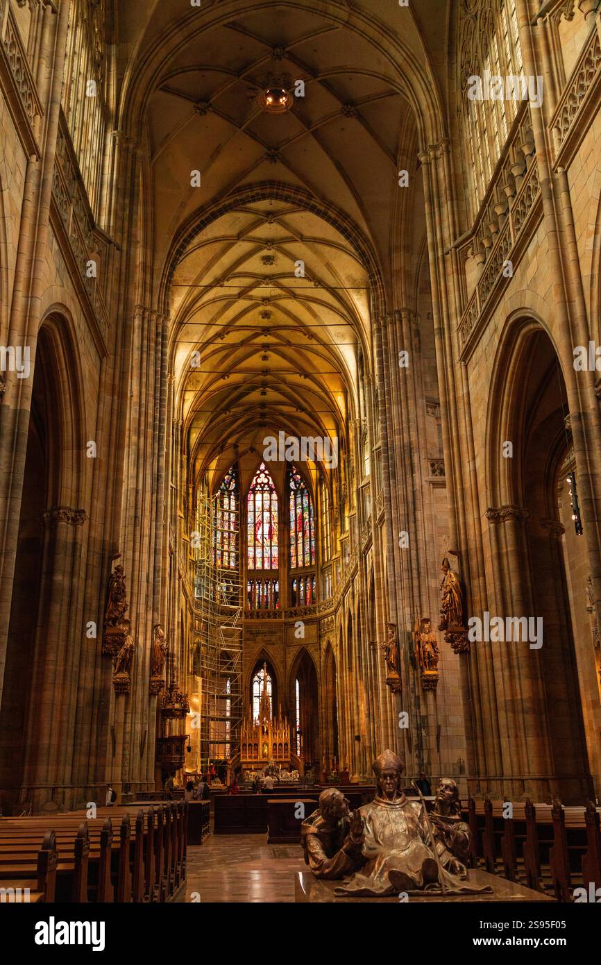 Interior of Gothic Cathedral inside. Carved pulpit, stained-glass ...