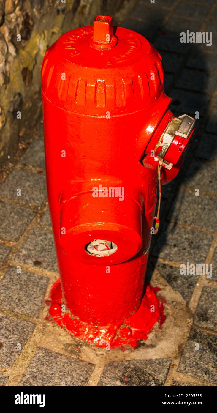 Front view, medium distance of a red fire water hydrant Stock Photo - Alamy