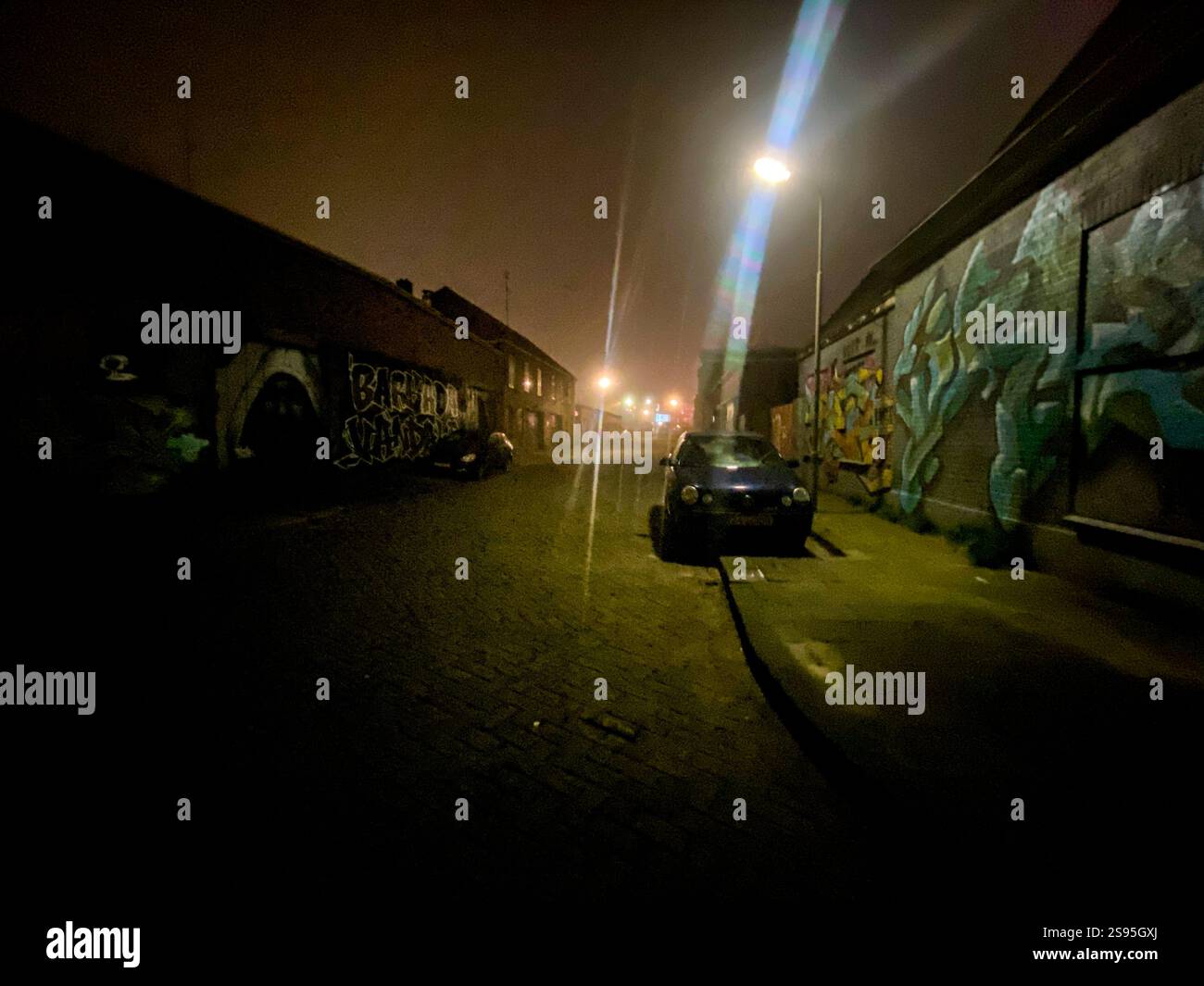 Mural & Graffiti on a Industrial Building's Wall during a winter night ...