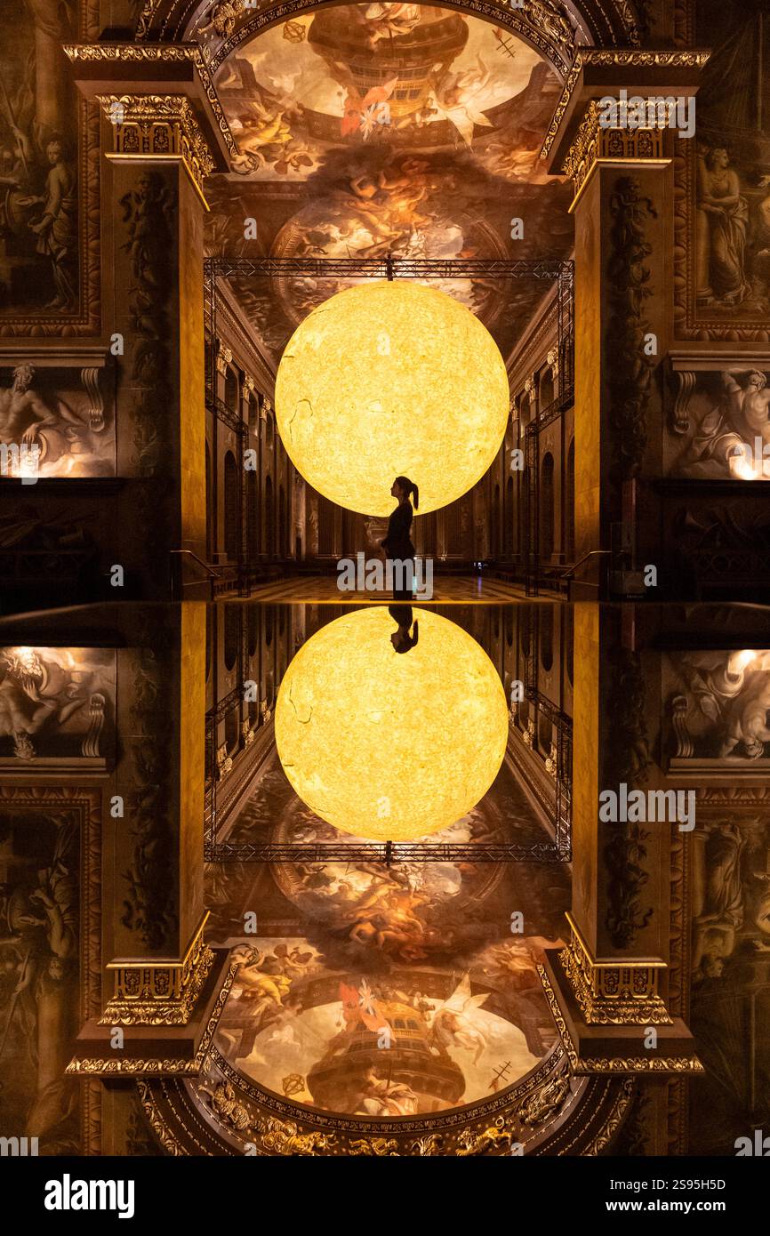 London, UK. 24 January 2025. A staff member with ‘Helios’ by artist ...