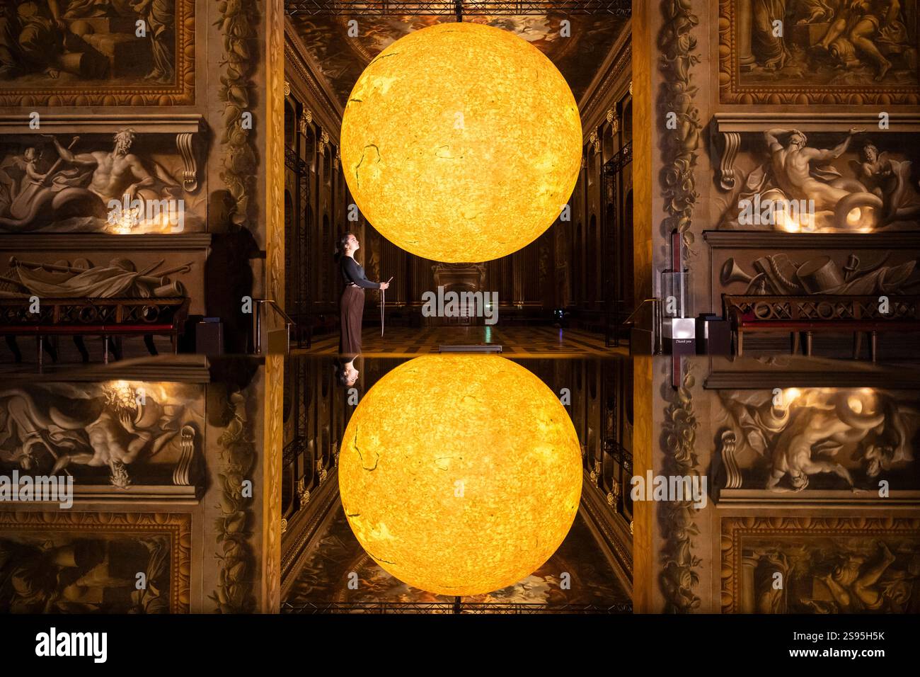 London, UK. 24 January 2025. A staff member with ‘Helios’ by artist ...