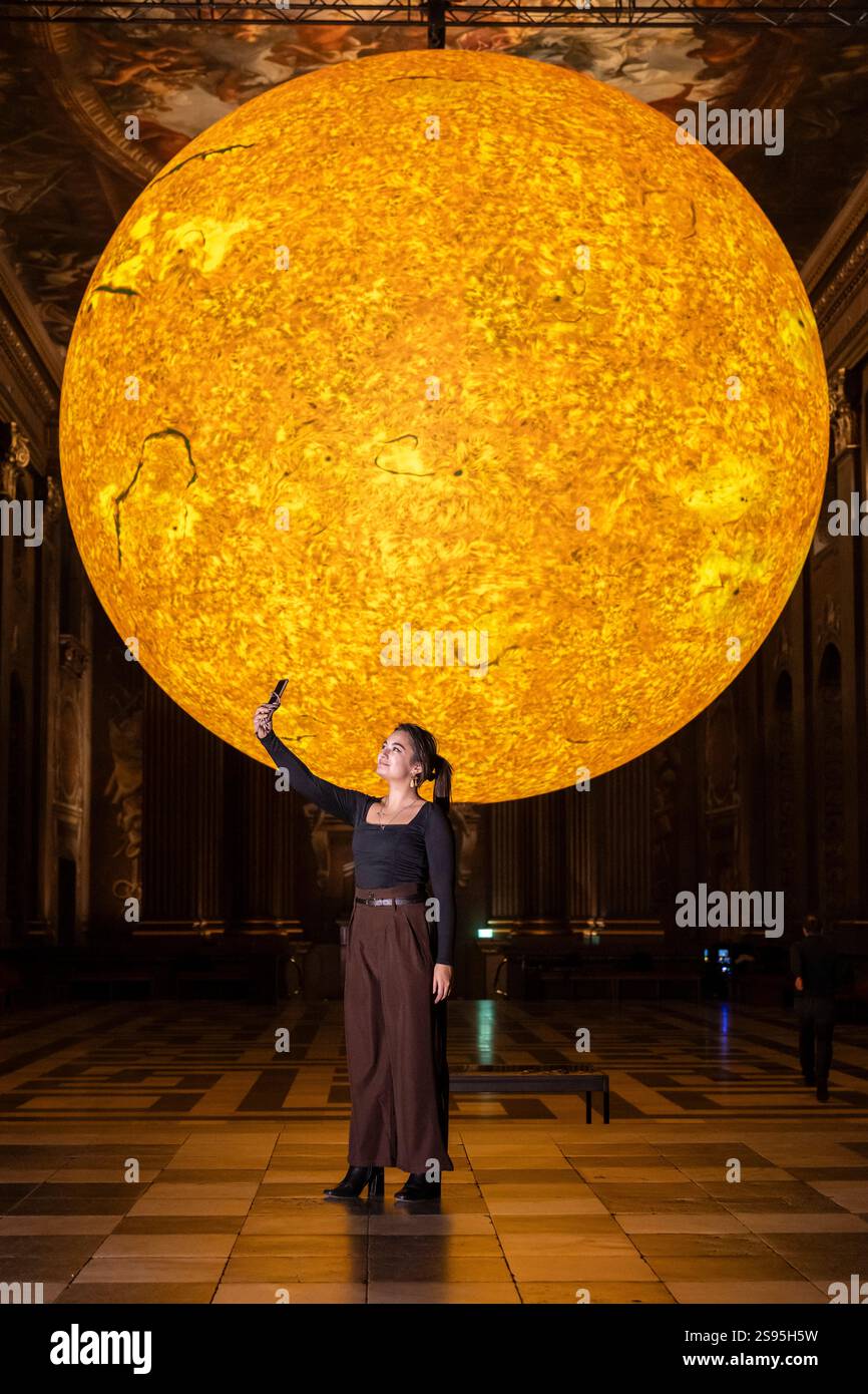 London, UK. 24 January 2025. A staff member with ‘Helios’ by artist ...