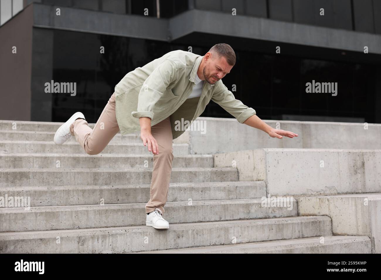 Man falling on stairs outdoors. Dangerous accident Stock Photo - Alamy