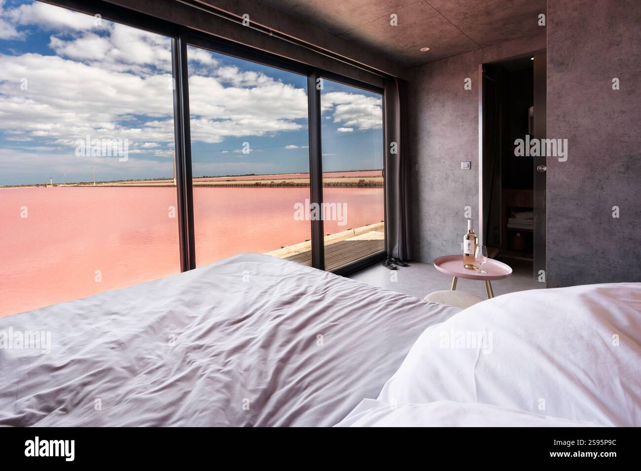 Contemporary cabin with a glass window overlooking the Salinas de ...