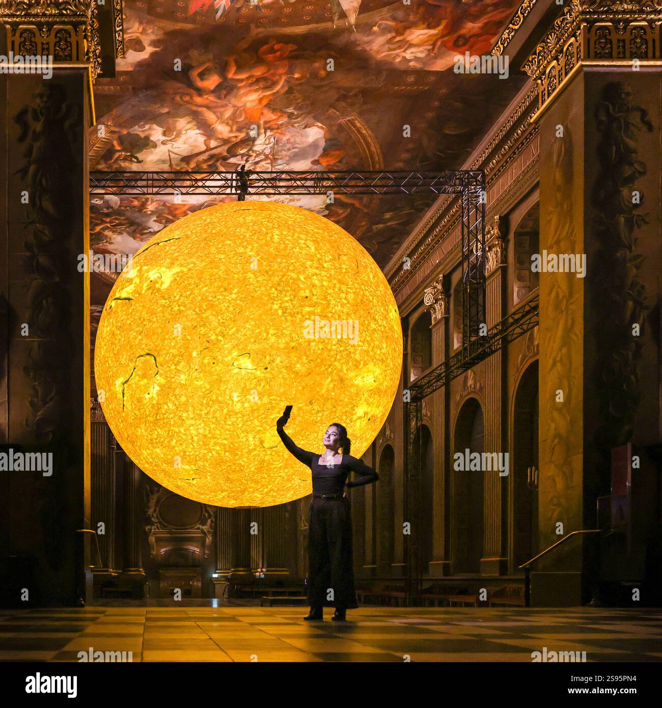 London, UK, 24th Jan 2025. Staff with the installation. The new 'Helios ...