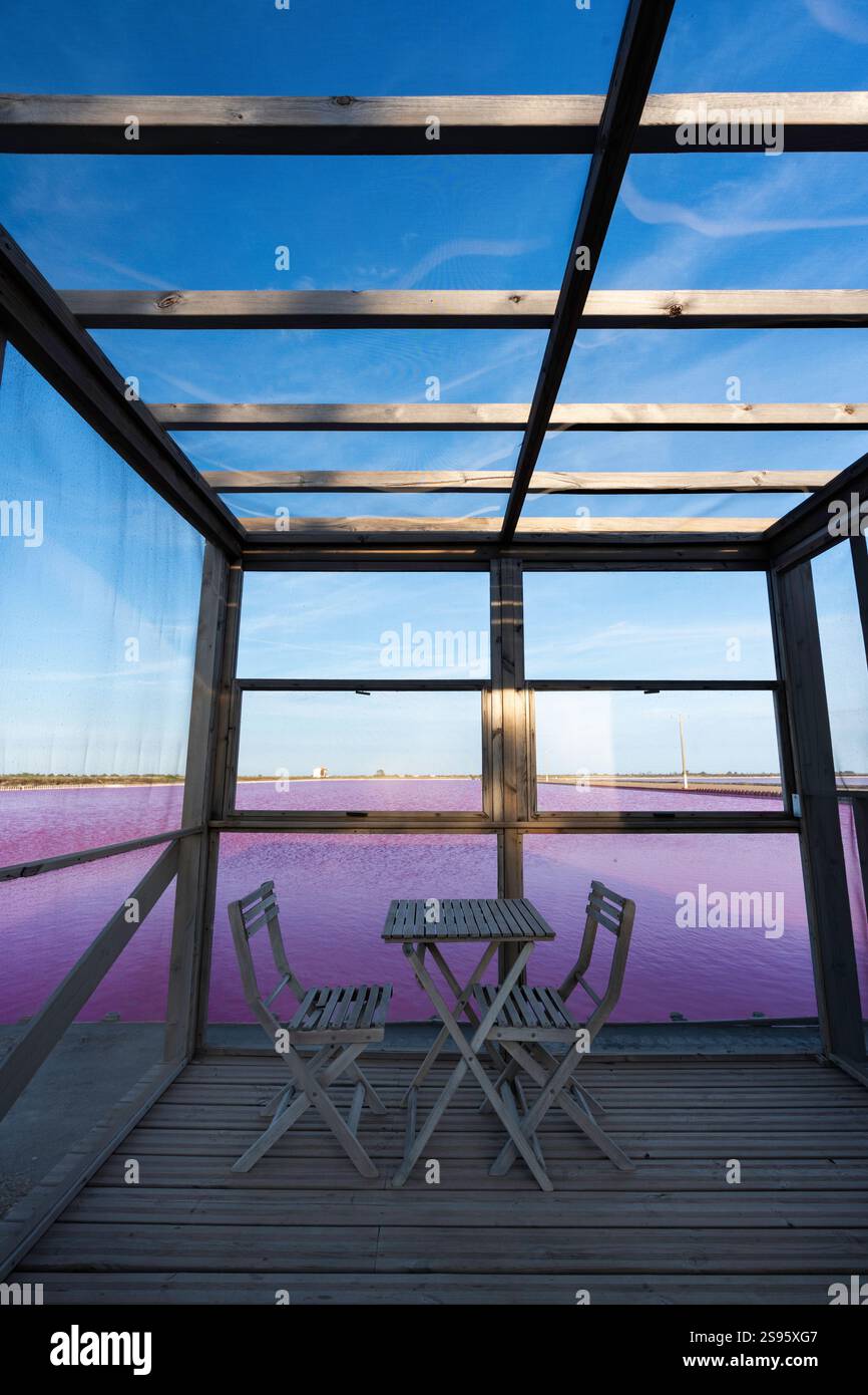 Sitting area on an enclosed screened-in sundeck overlooking Salinas de ...