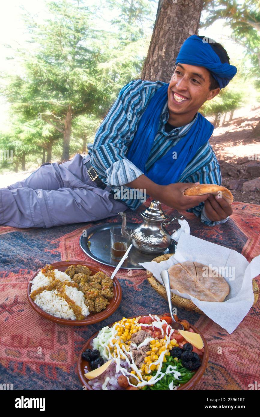 eating typical Berber lunch of kafta and rice in ginger; saffron ...