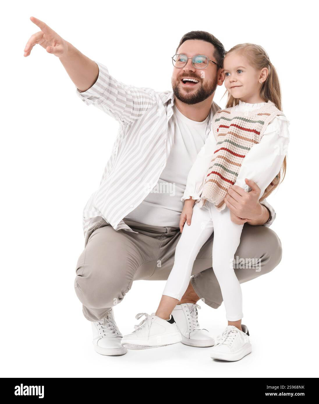 Happy father with his cute little daughter looking at something on white background Stock Photo ...