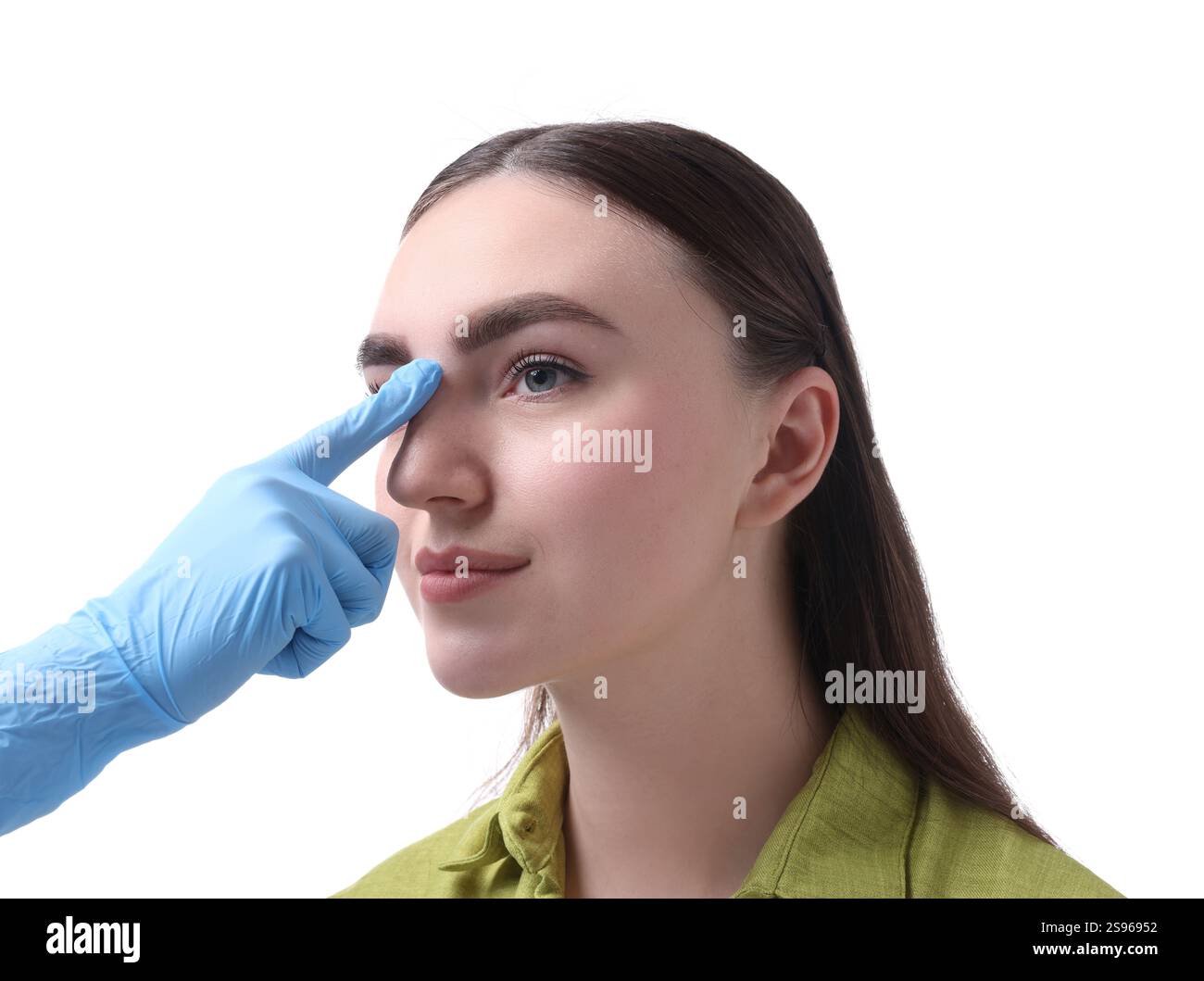 Doctor checking patient's nose before plastic surgery operation on ...