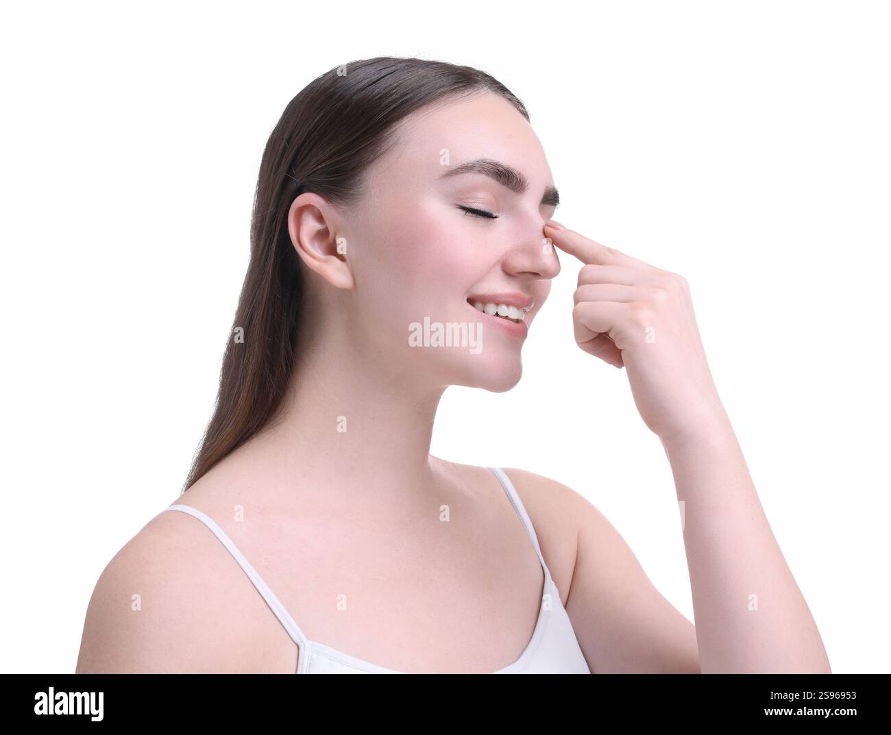 Woman touching her nose on white background Stock Photo - Alamy