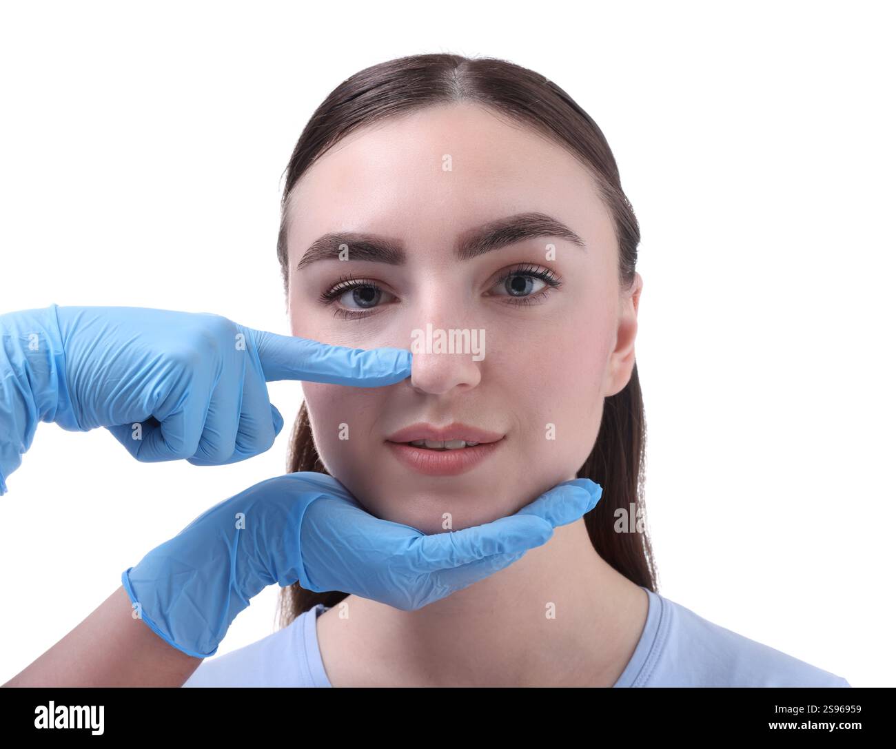 Doctor checking patient's nose before plastic surgery operation on ...
