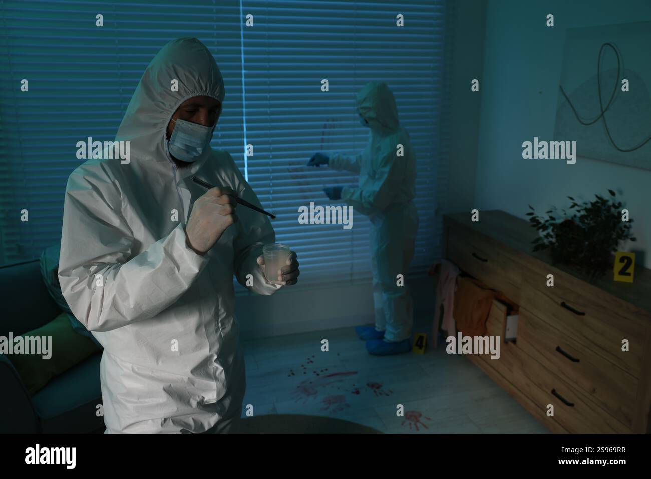 Forensic experts working at crime scene indoors Stock Photo - Alamy