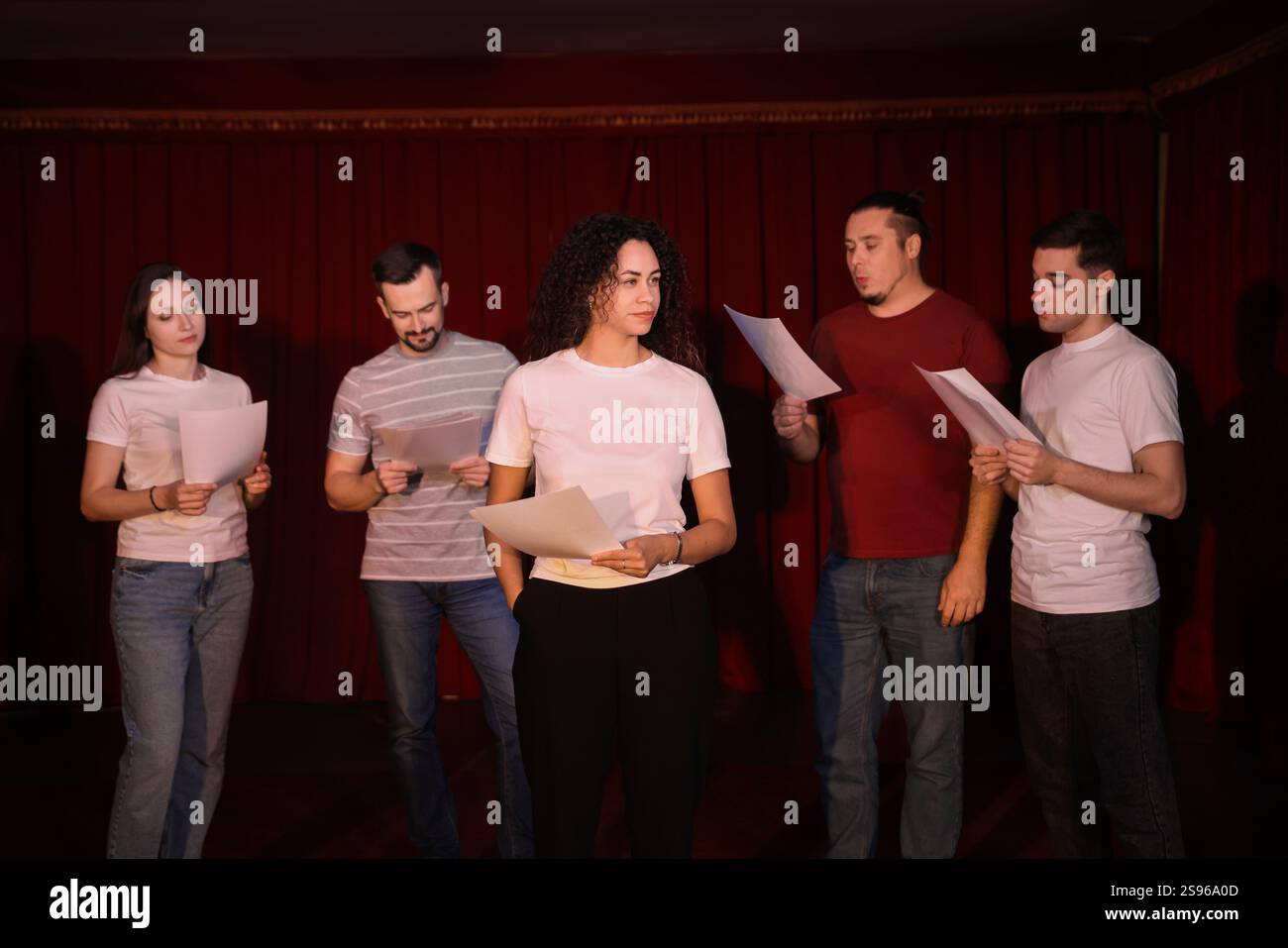 Professional actors with their scripts rehearsing in theatre Stock ...