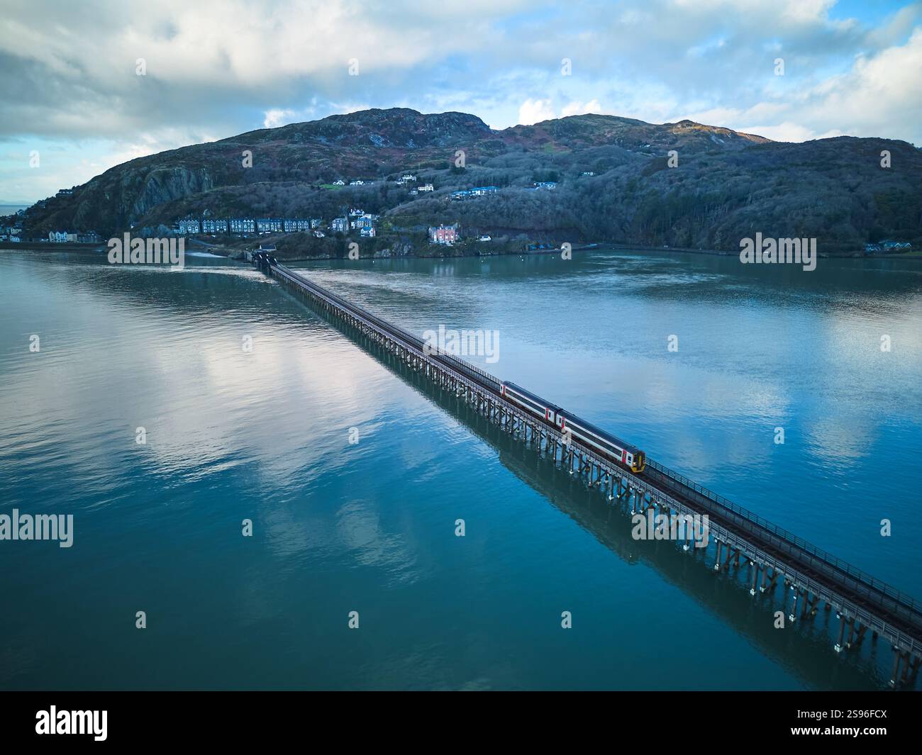 train crossing Barmouth Bridge on the Cambrian Coast railway line ...