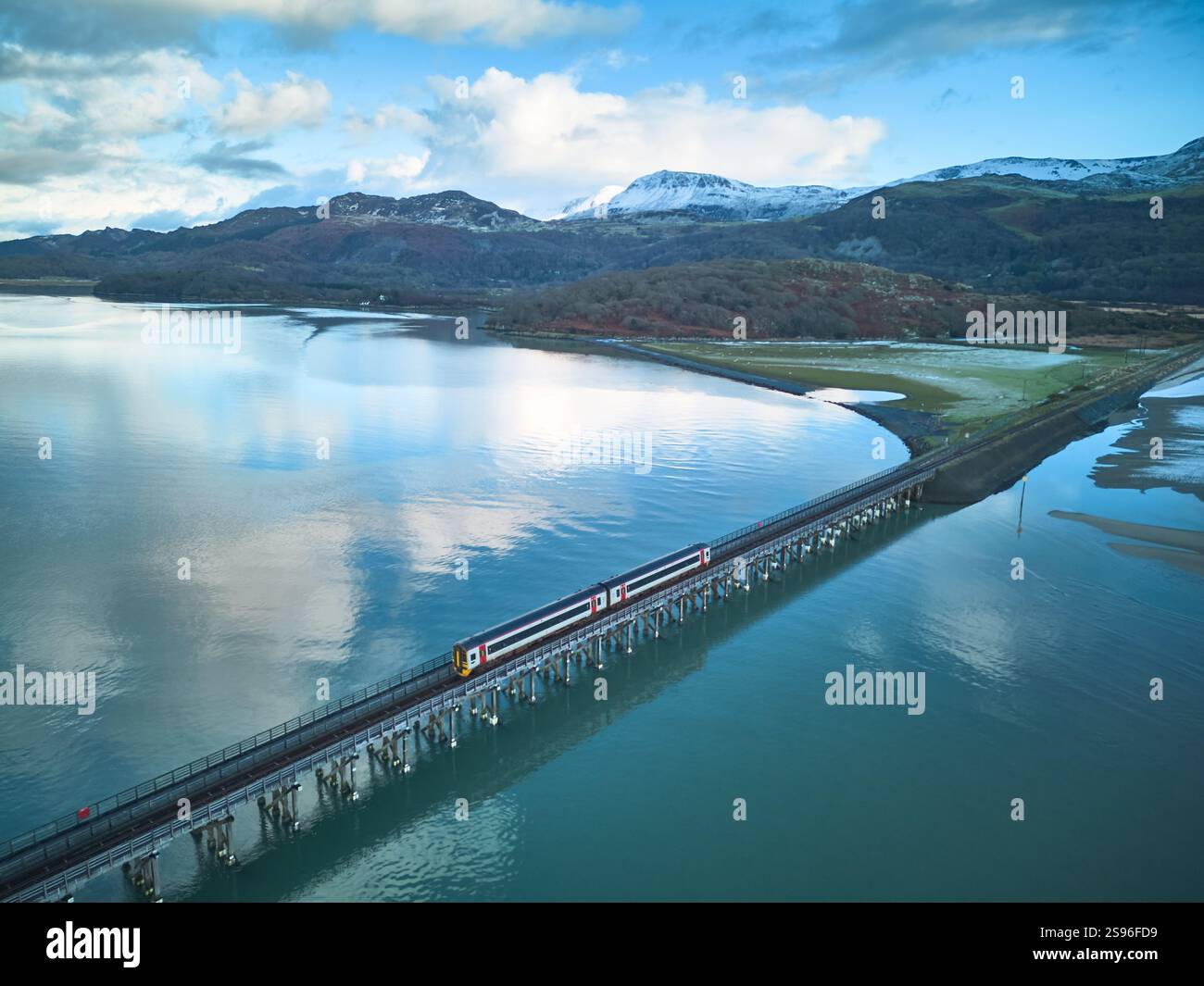 train crossing Barmouth Bridge on the Cambrian Coast railway line ...