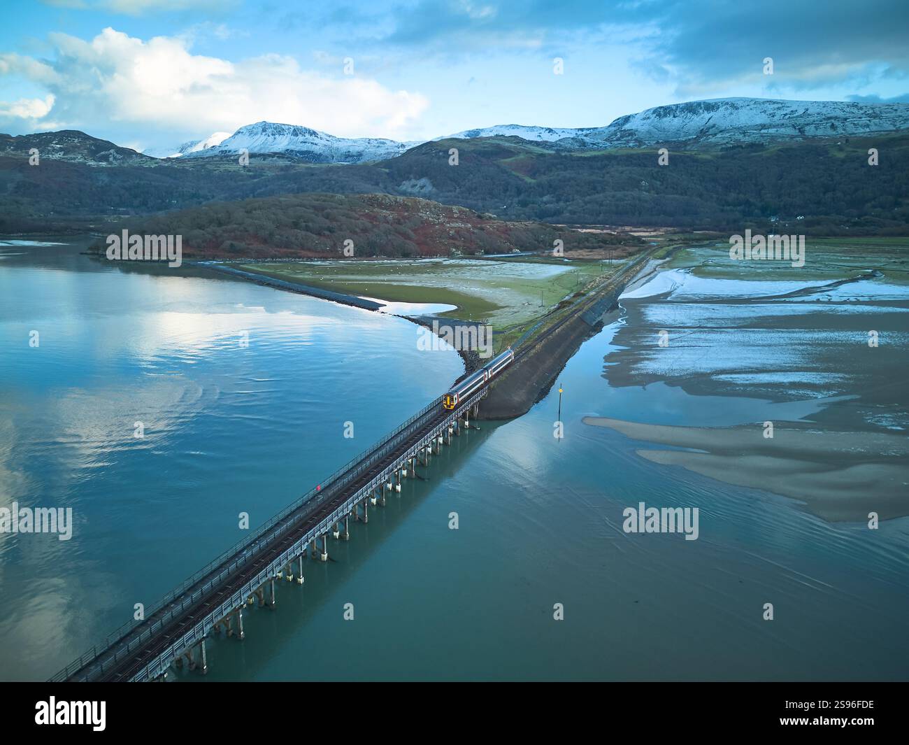 train crossing Barmouth Bridge on the Cambrian Coast railway line ...