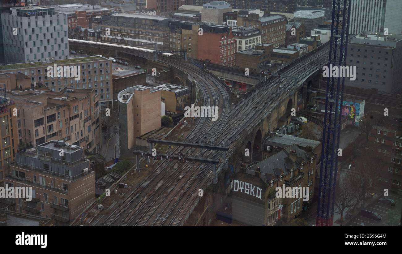 Aerial view of railway tracks winding through urban London, UK ...