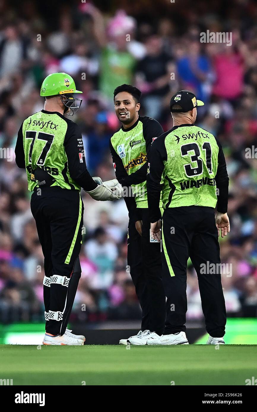 Tanveer Sangha of Sydney Thunder celebrates with teammates David Warner ...