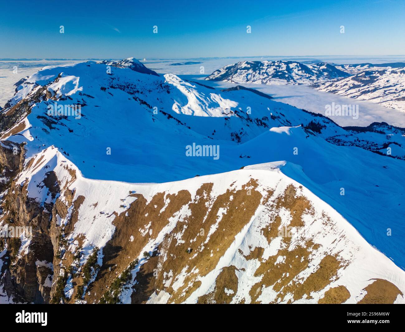 Aerial drone view of snow covered mountains and ski slopes, ski area ...
