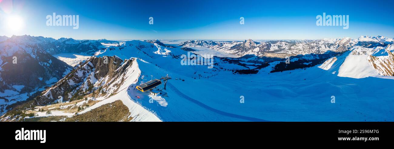 Aerial drone view of snow covered mountains and ski slopes, ski area ...