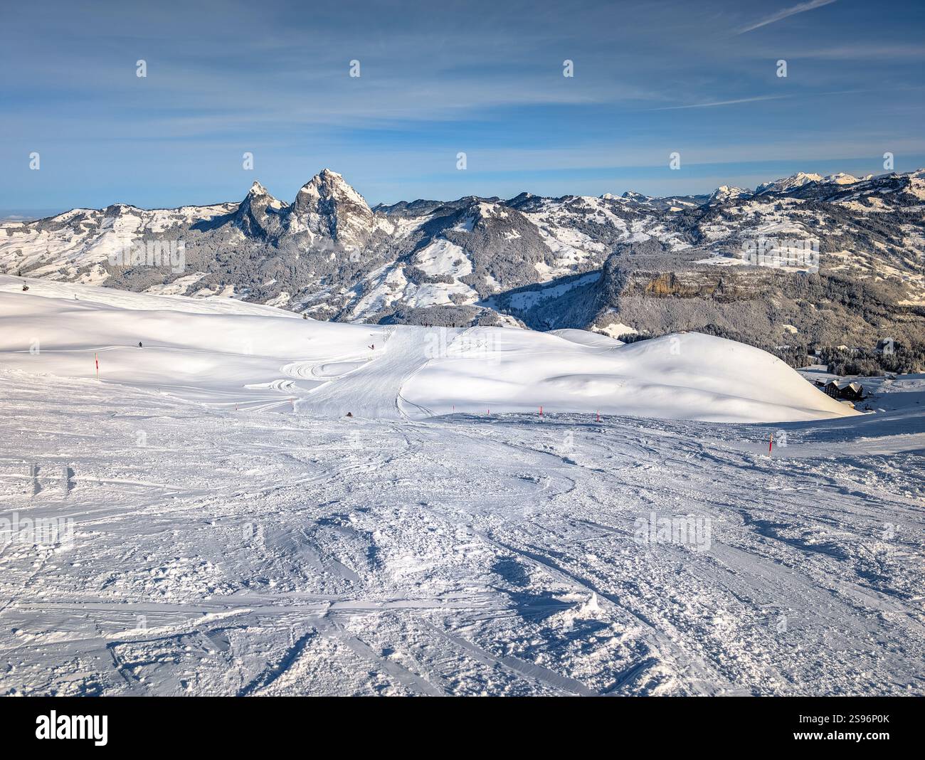 Aerial drone view of snow covered mountains and ski slopes, ski area ...