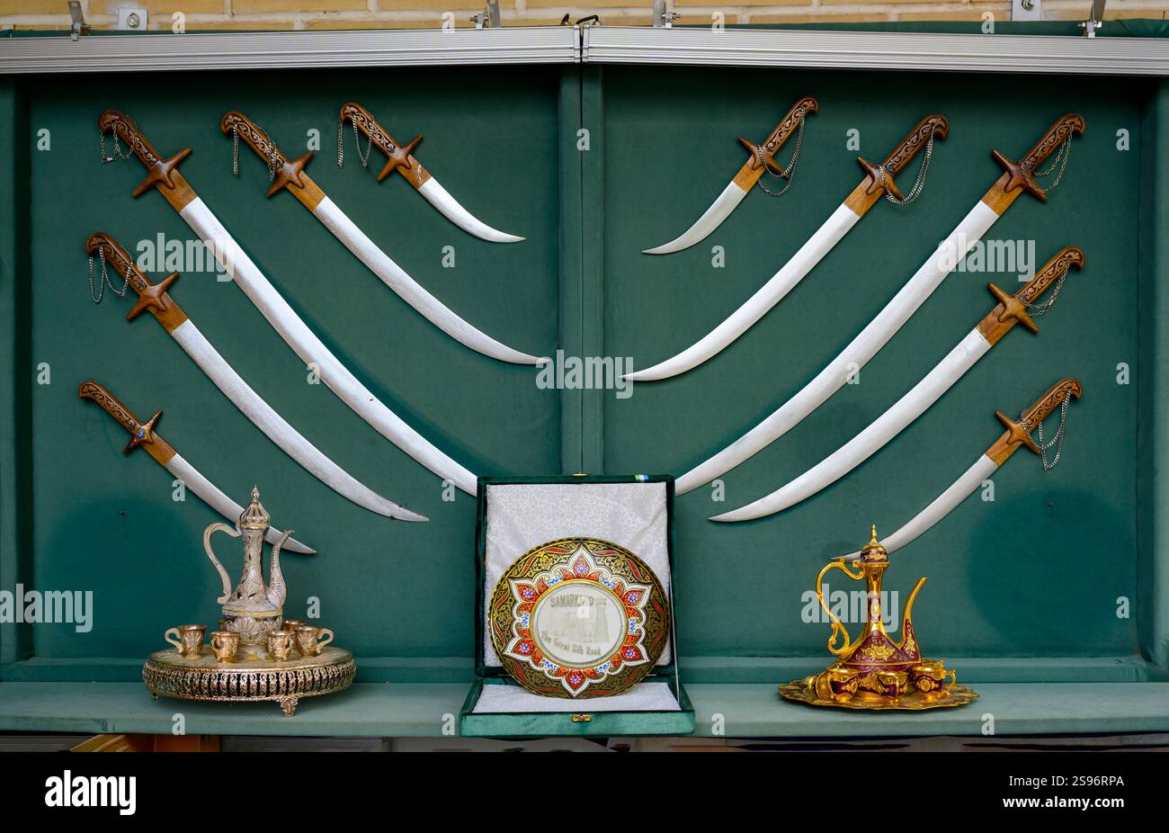Traditional Uzbek daggers, swords, silver jugs and cups made by modern ...
